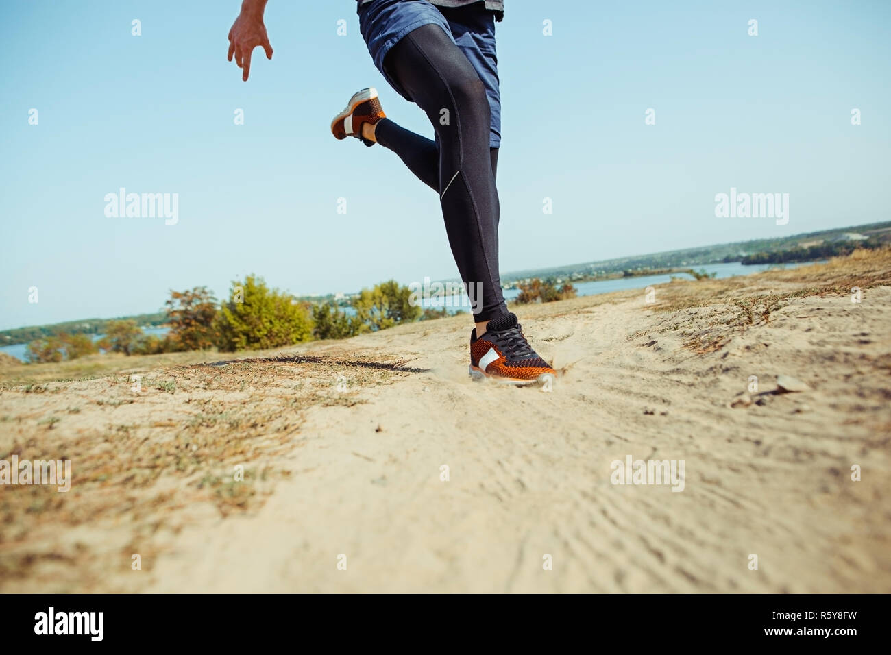 Running sport. Man runner sprinting outdoor in scenic nature. Fit ...