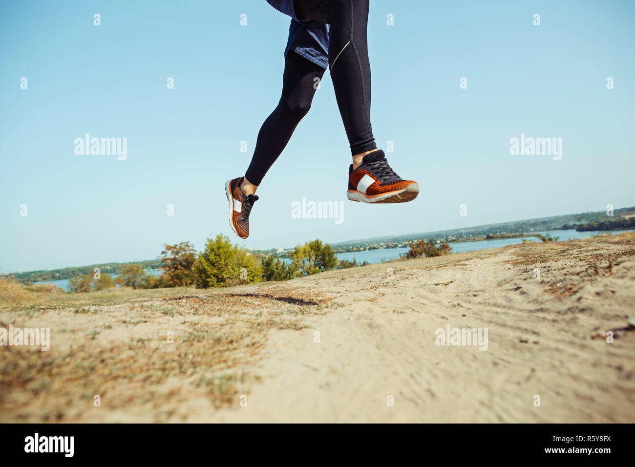 Running sport. Man runner sprinting outdoor in scenic nature. Fit ...