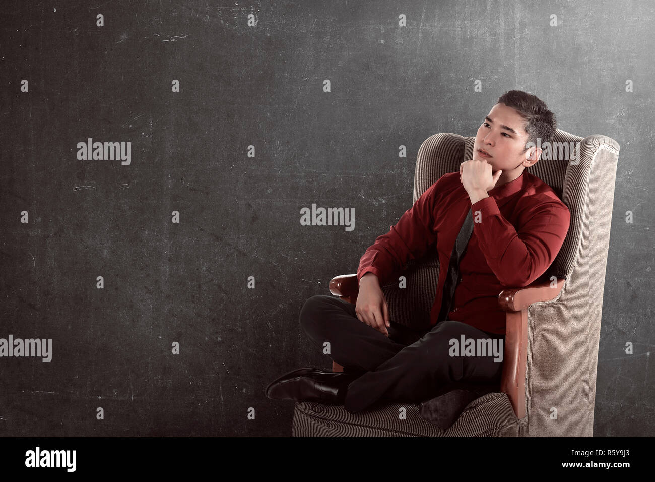Asian business man seat on the chair Stock Photo - Alamy
