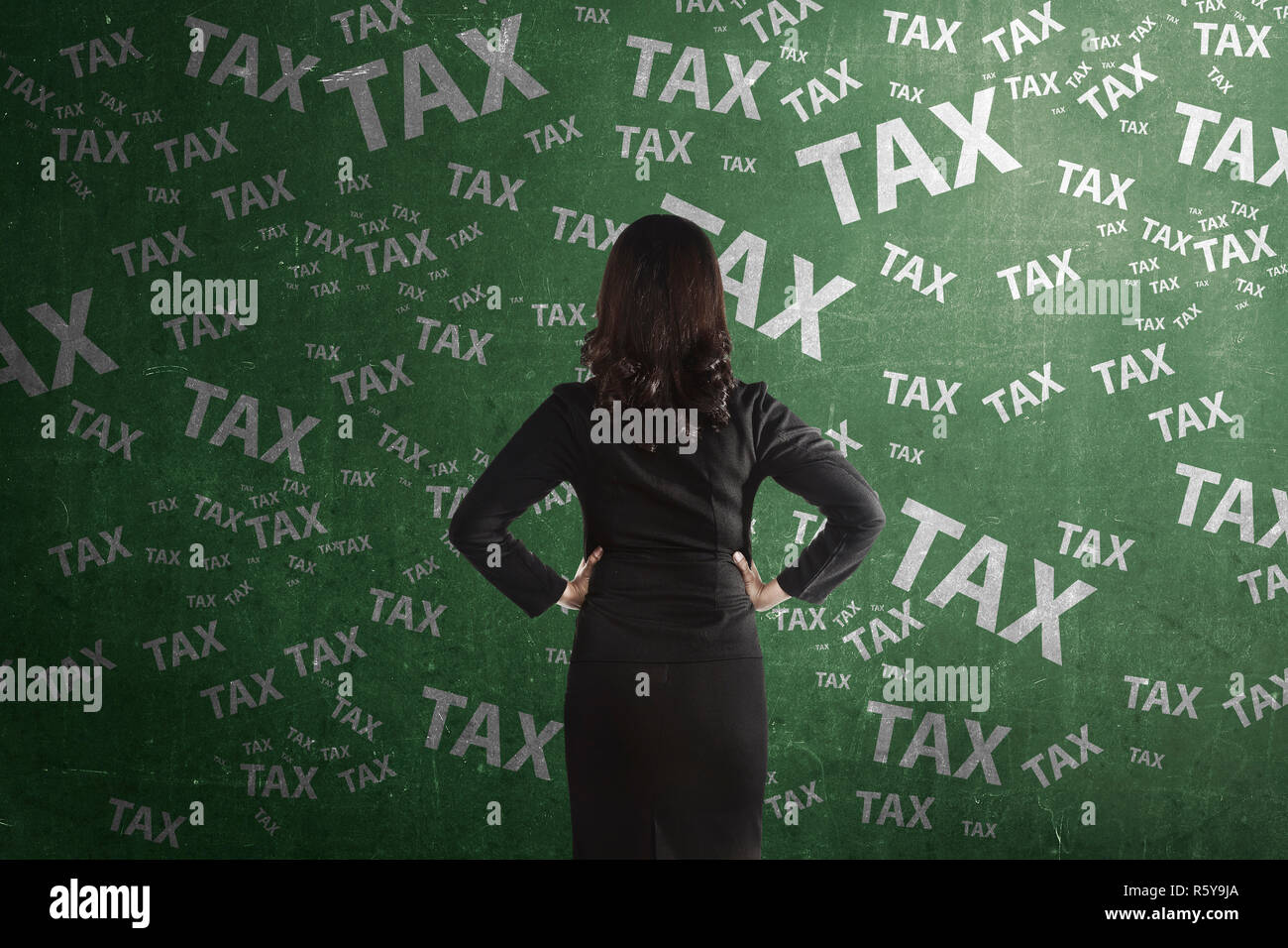 Asian business person thinking hard about tax Stock Photo - Alamy