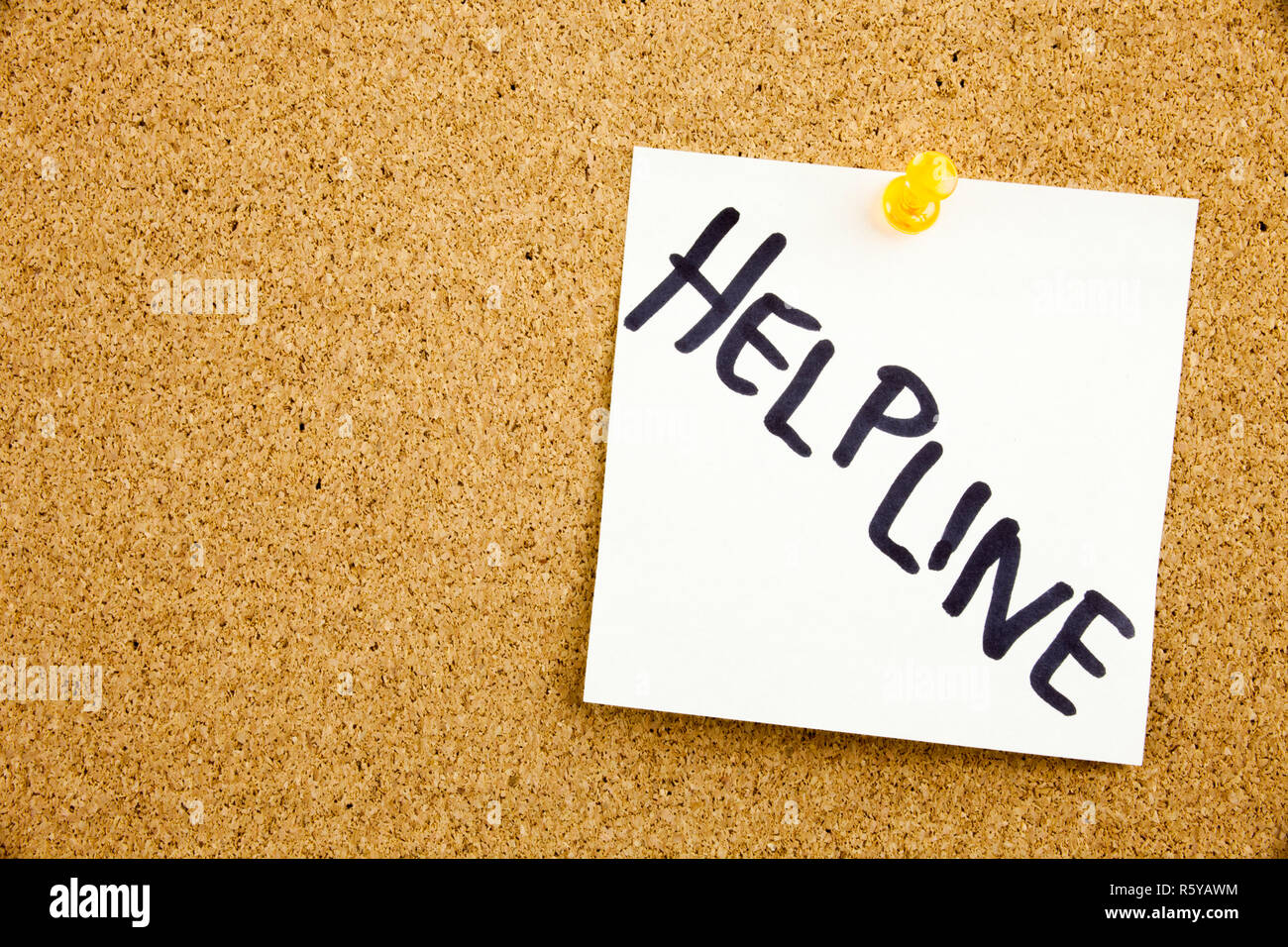 A yellow sticky note writing, caption, inscription Phrase HELP LINE ...