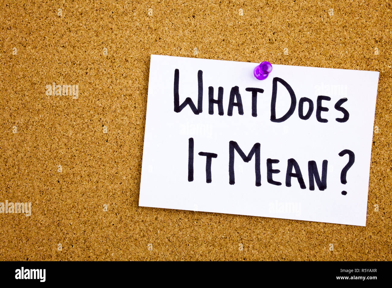 A yellow sticky note writing, caption, inscription what does it mean ...