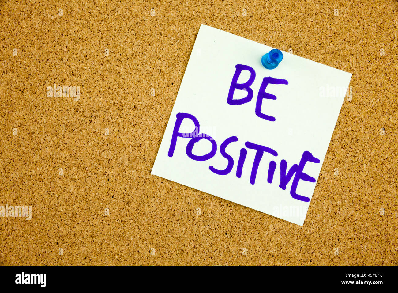 A yellow sticky note writing, caption, inscription be positive ...