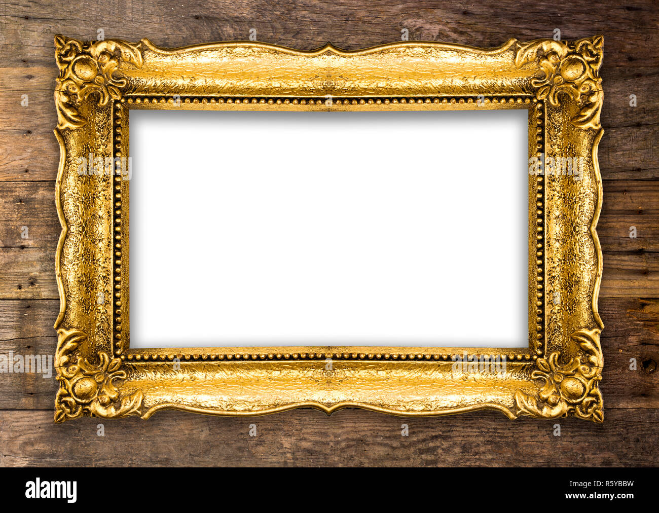 Retro Old Gold Picture Frame on wooden wall Stock Photo - Alamy