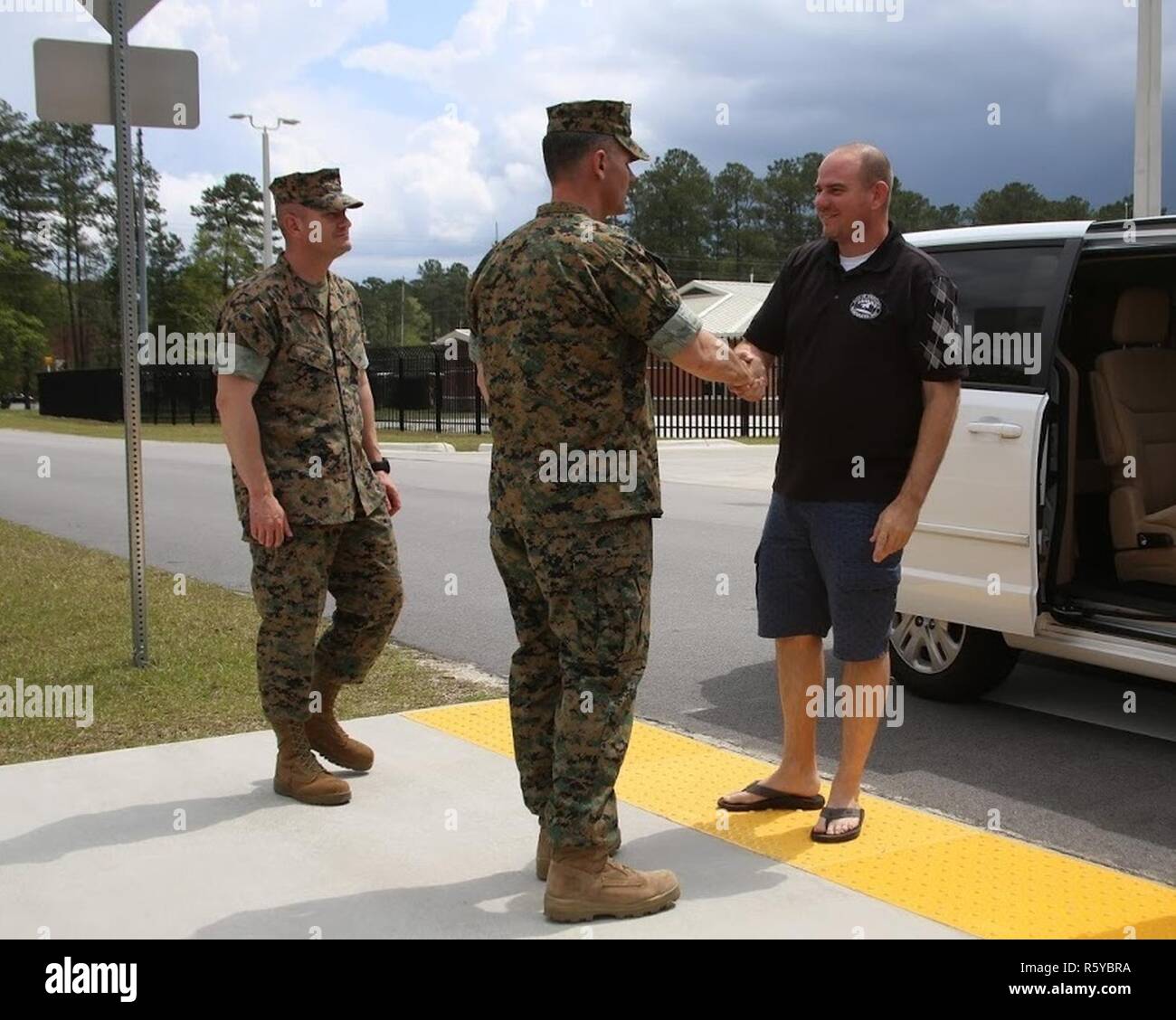 Sgt. Maj. Marinica Ariton, left, and Lt. Col. Jeremy Winters, center ...