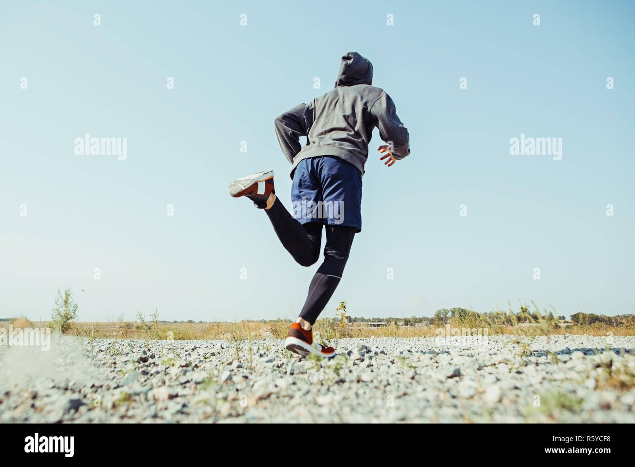 Running sport. Man runner sprinting outdoor in scenic nature. Fit ...