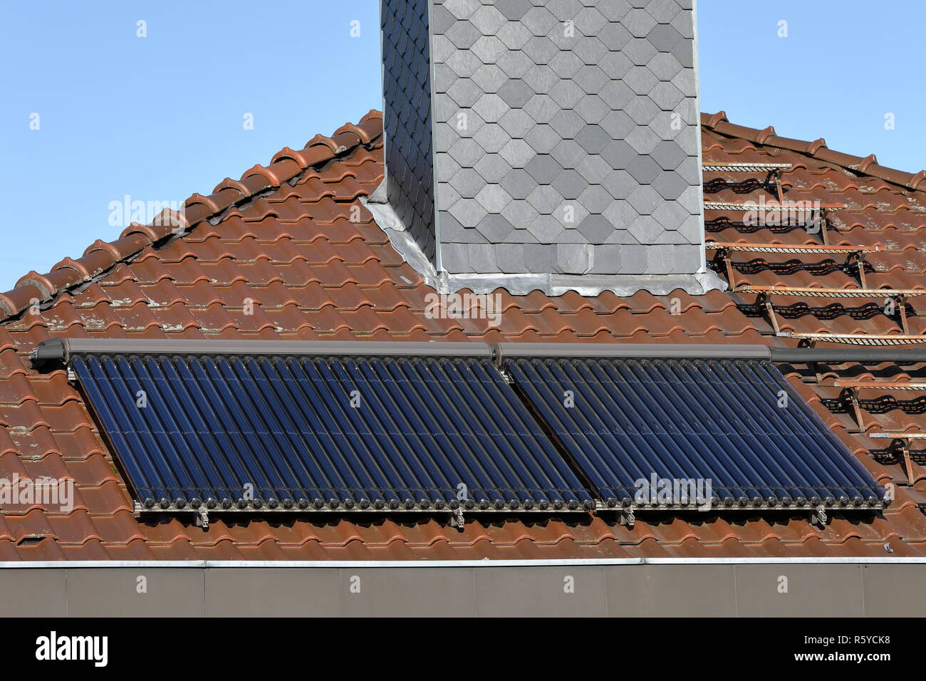 solar collectors on a house roof Stock Photo - Alamy