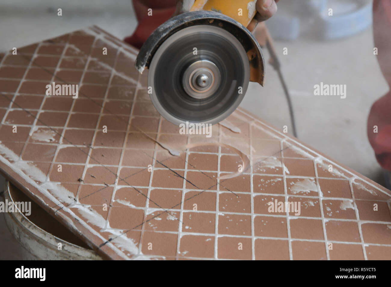 Worker holding tile adhesive hi-res stock photography and images - Alamy