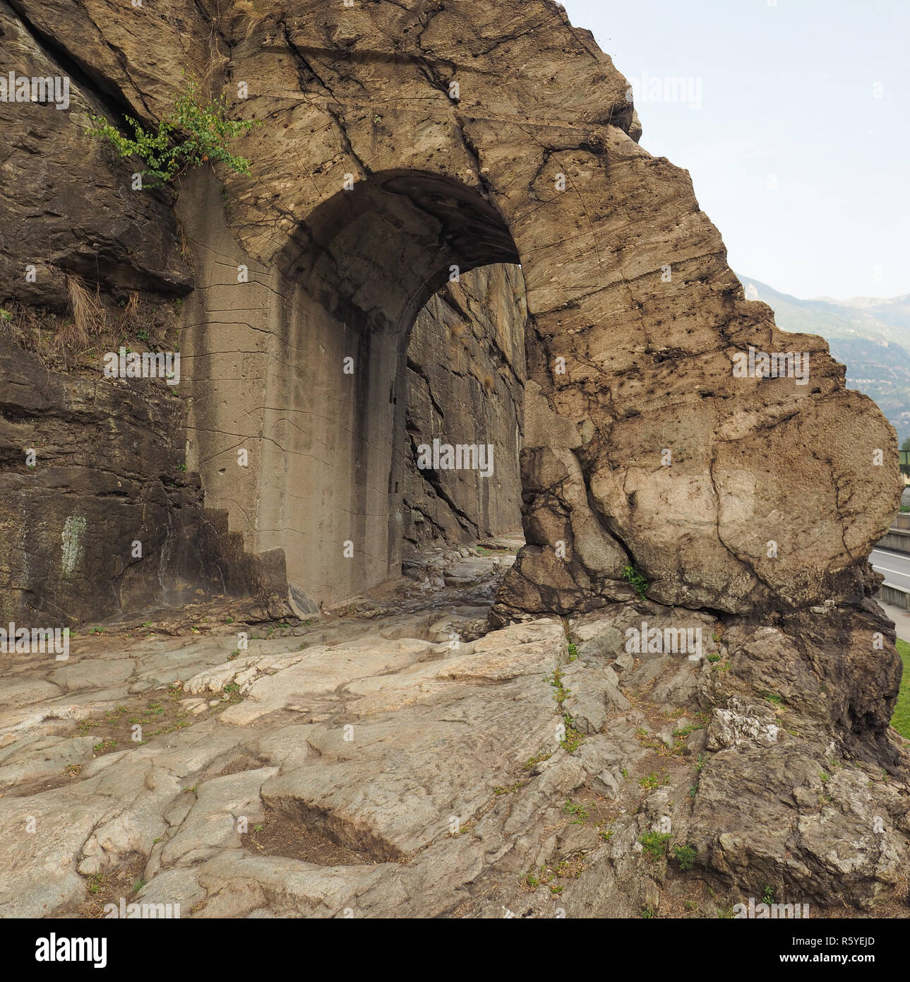 Ancient roman road arch in Donnas Stock Photo - Alamy