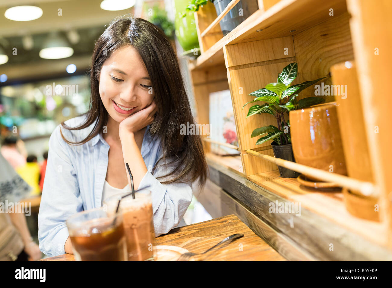 Woman in coffee shop Stock Photo - Alamy