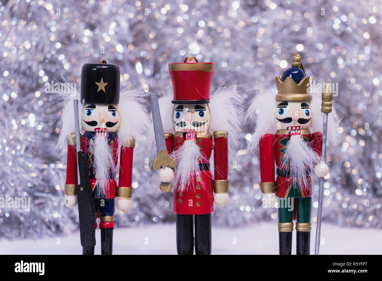 Three Christmas Nutcrackers. Sparkling background Stock Photo - Alamy