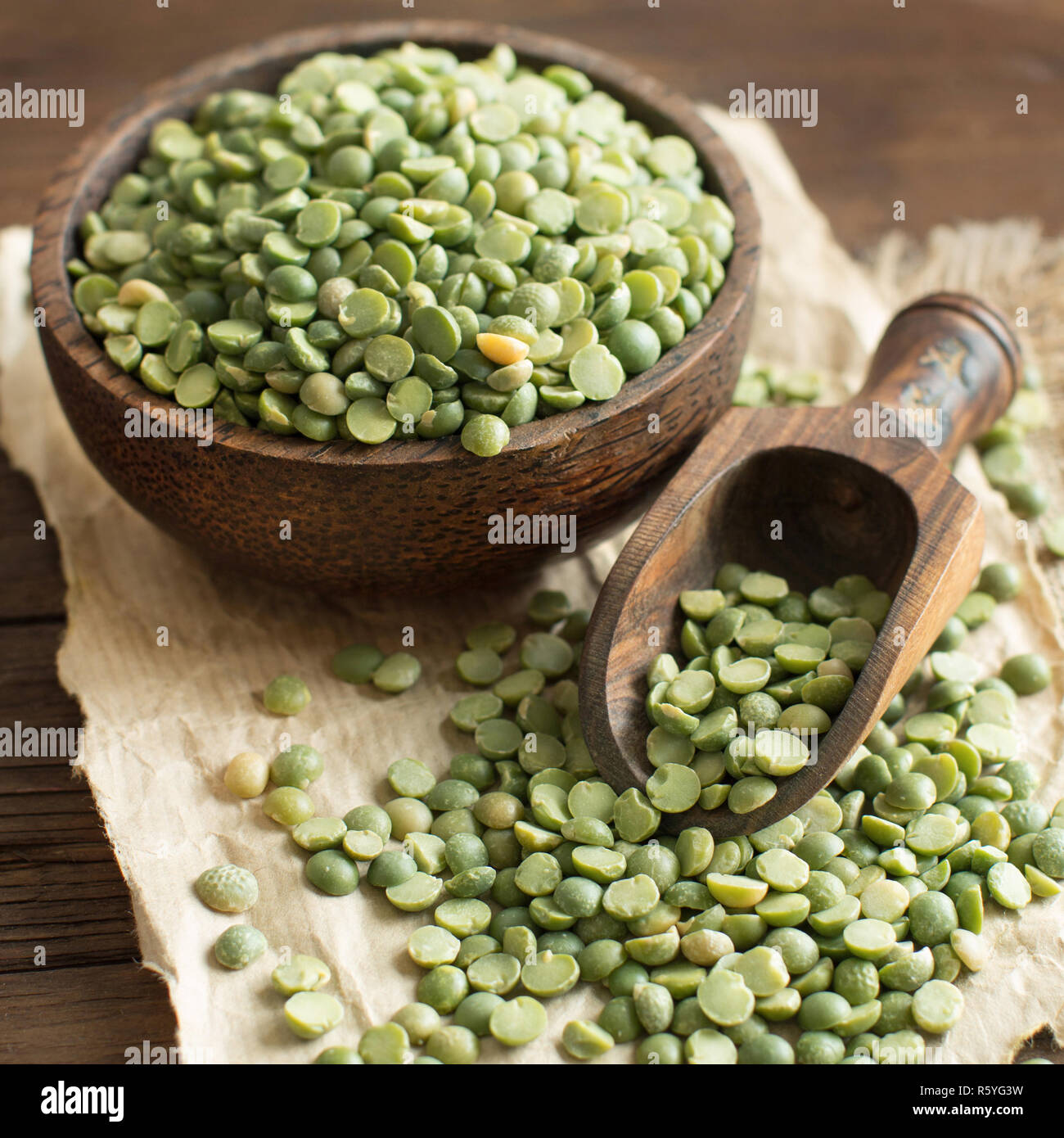 Uncooked Green Split Peas in a bowl with a spoon Stock Photo - Alamy
