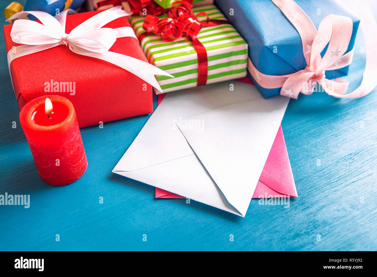 Colorful gifts and blank letters Stock Photo - Alamy