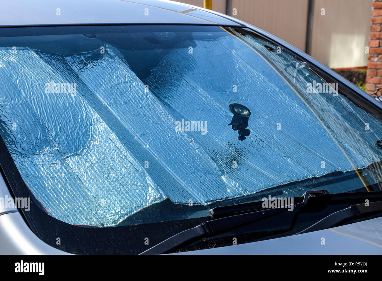Protection of the car panel from direct sunlight. Sun Reflector Stock ...