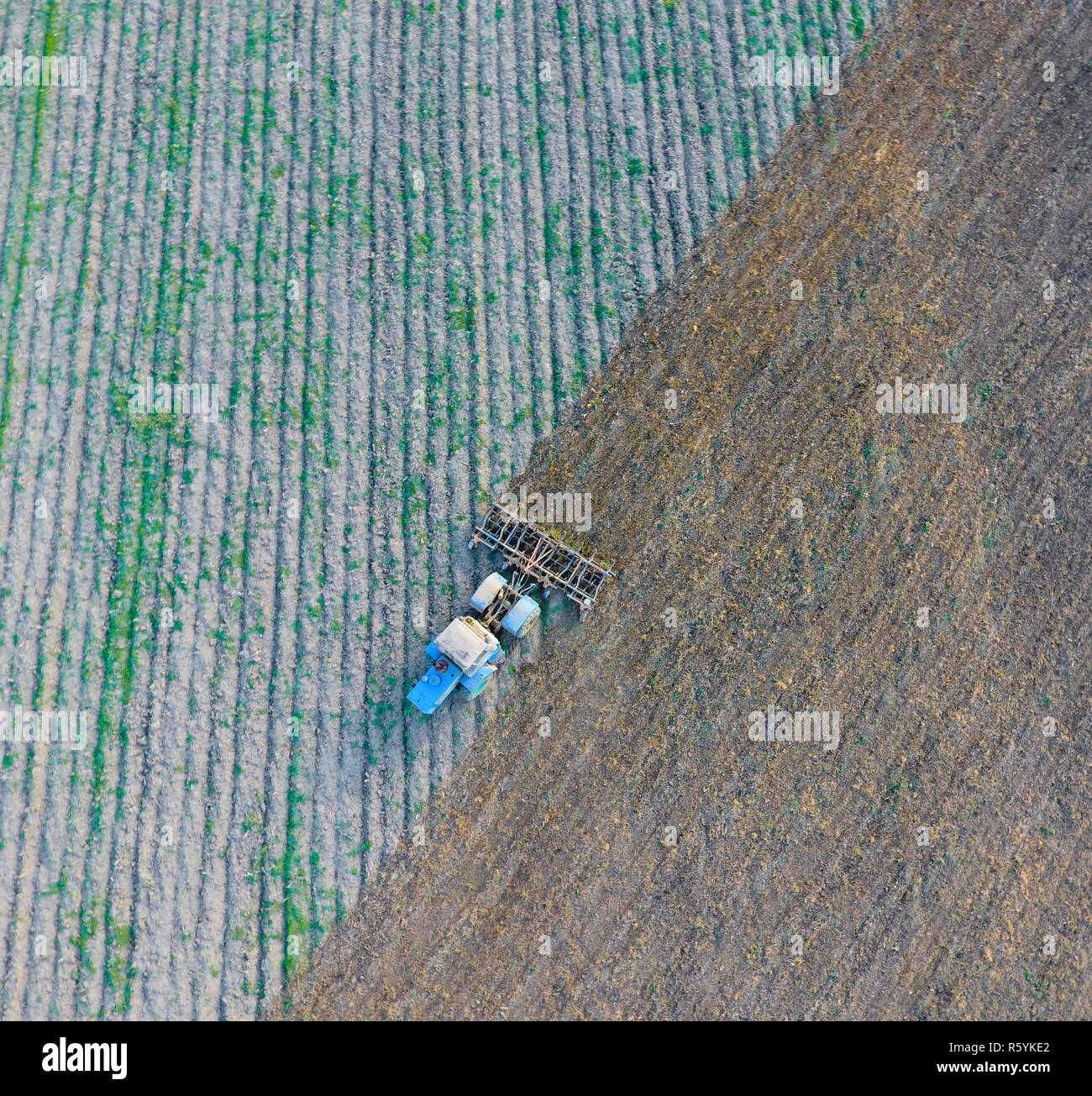 Top view of the tractor that plows the field. disking the soil Stock ...