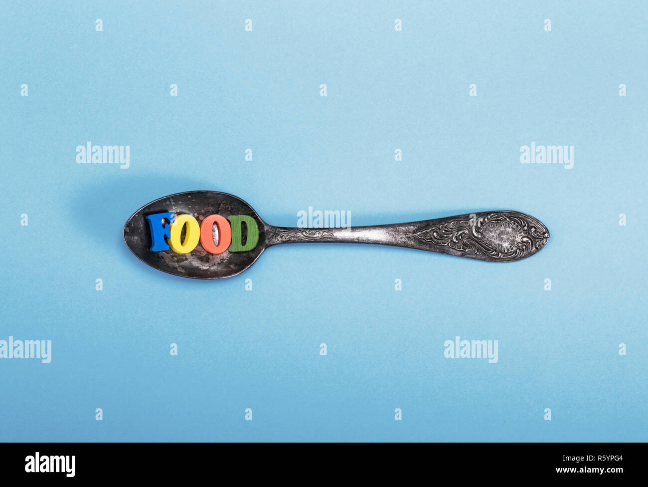 iron spoon and label food wooden letters Stock Photo - Alamy