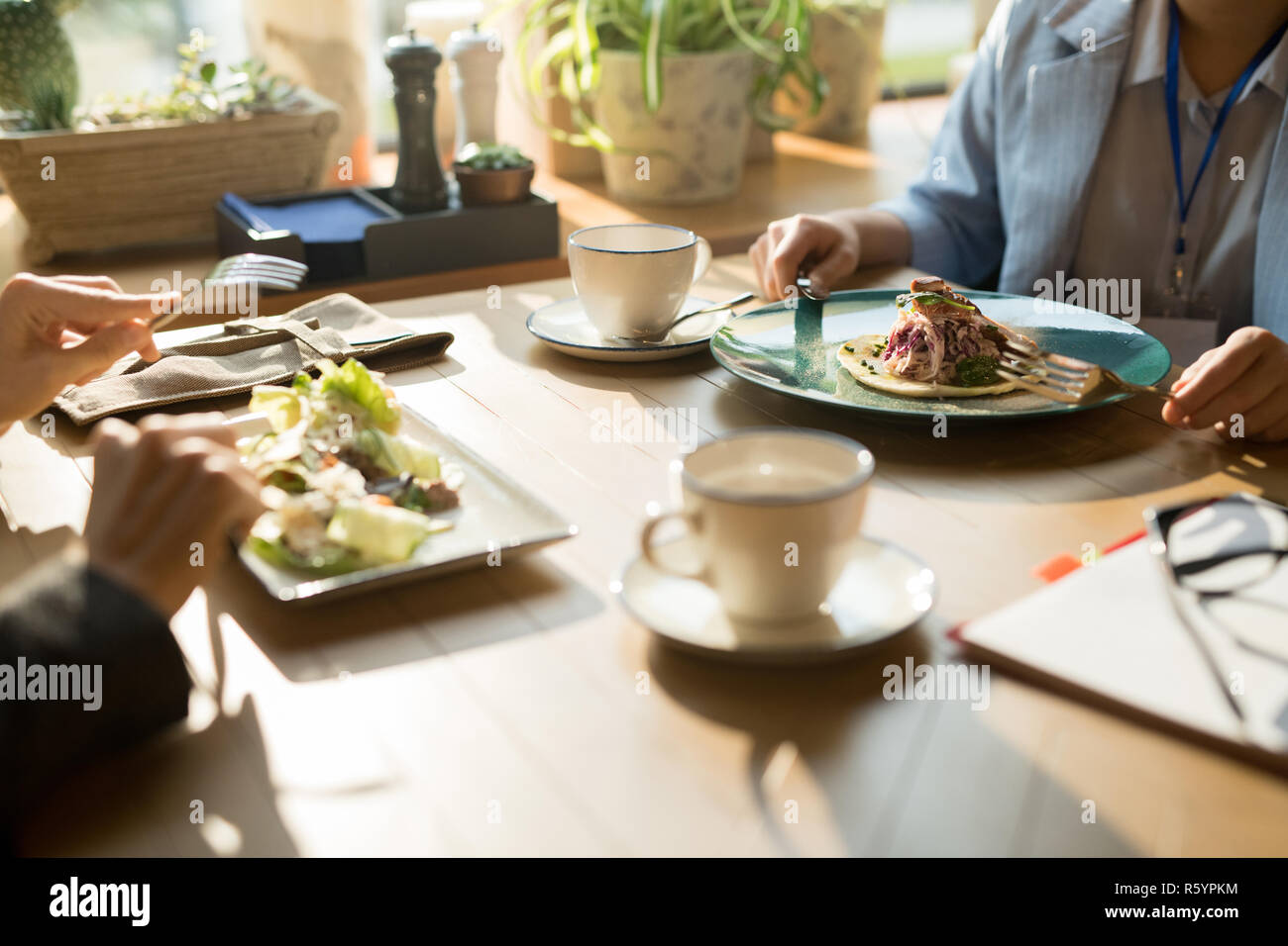 Having lunch in restaurant Stock Photo - Alamy