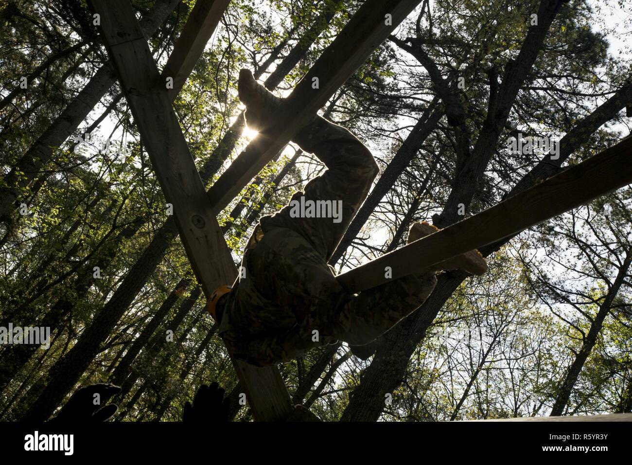 A Combat Cameraman manuevers through the weaver obstacle during the ...
