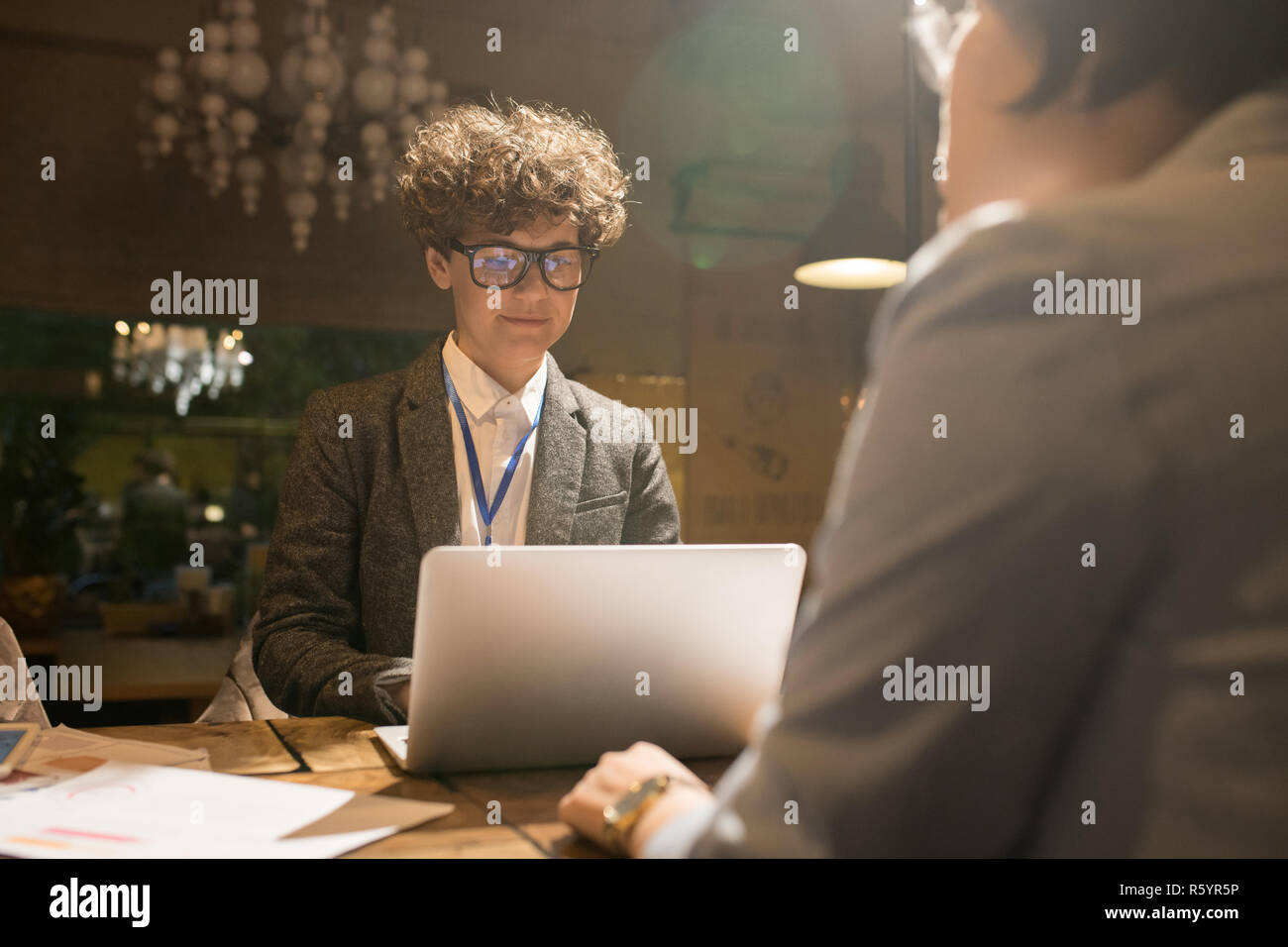 Smart programmer using laptop in dark office Stock Photo - Alamy