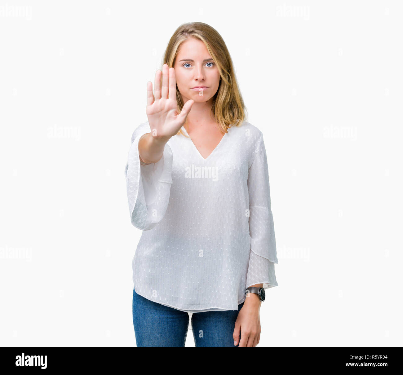 Beautiful young elegant woman over isolated background doing stop sing ...