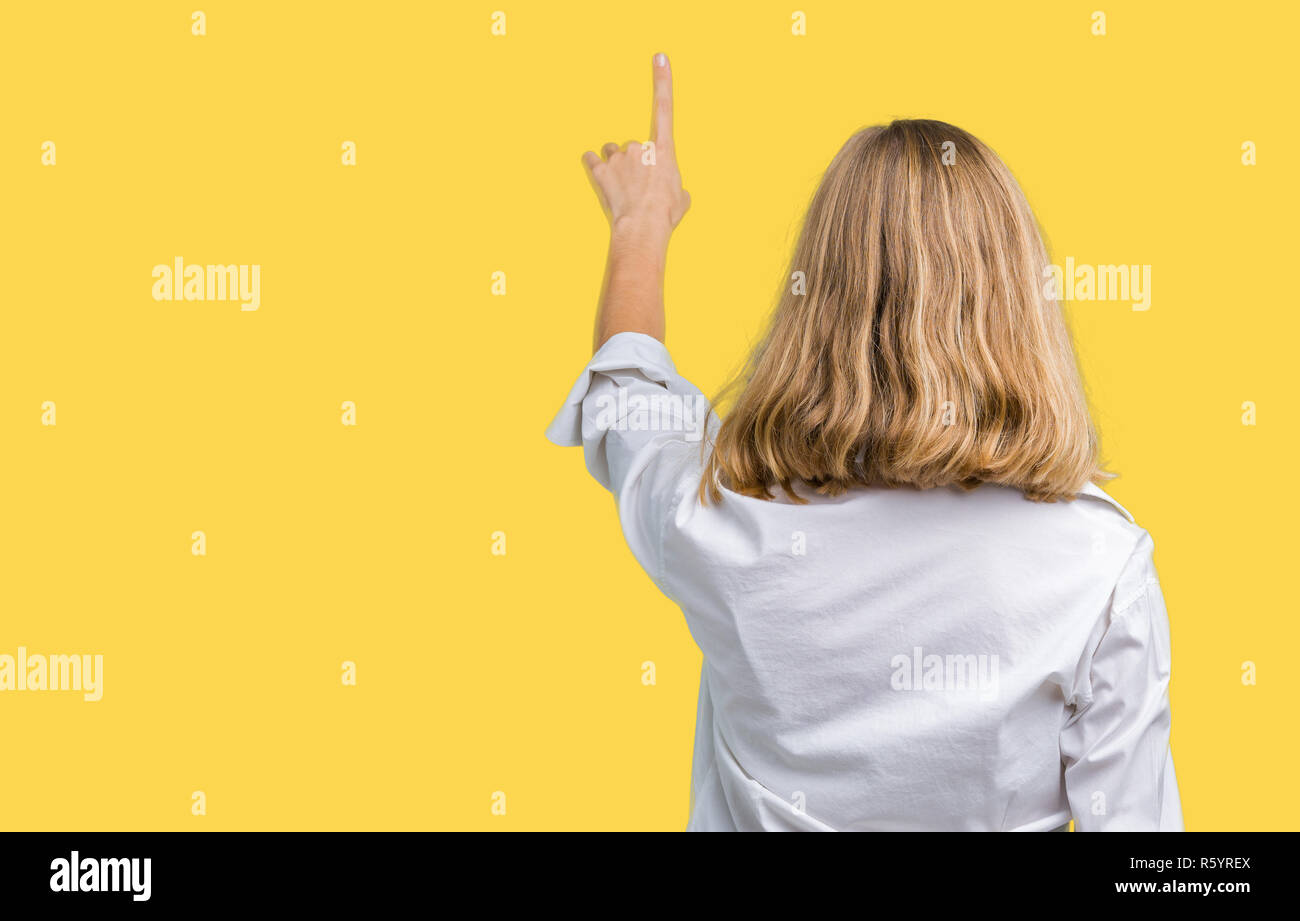 Beautiful young business woman over isolated background Posing ...