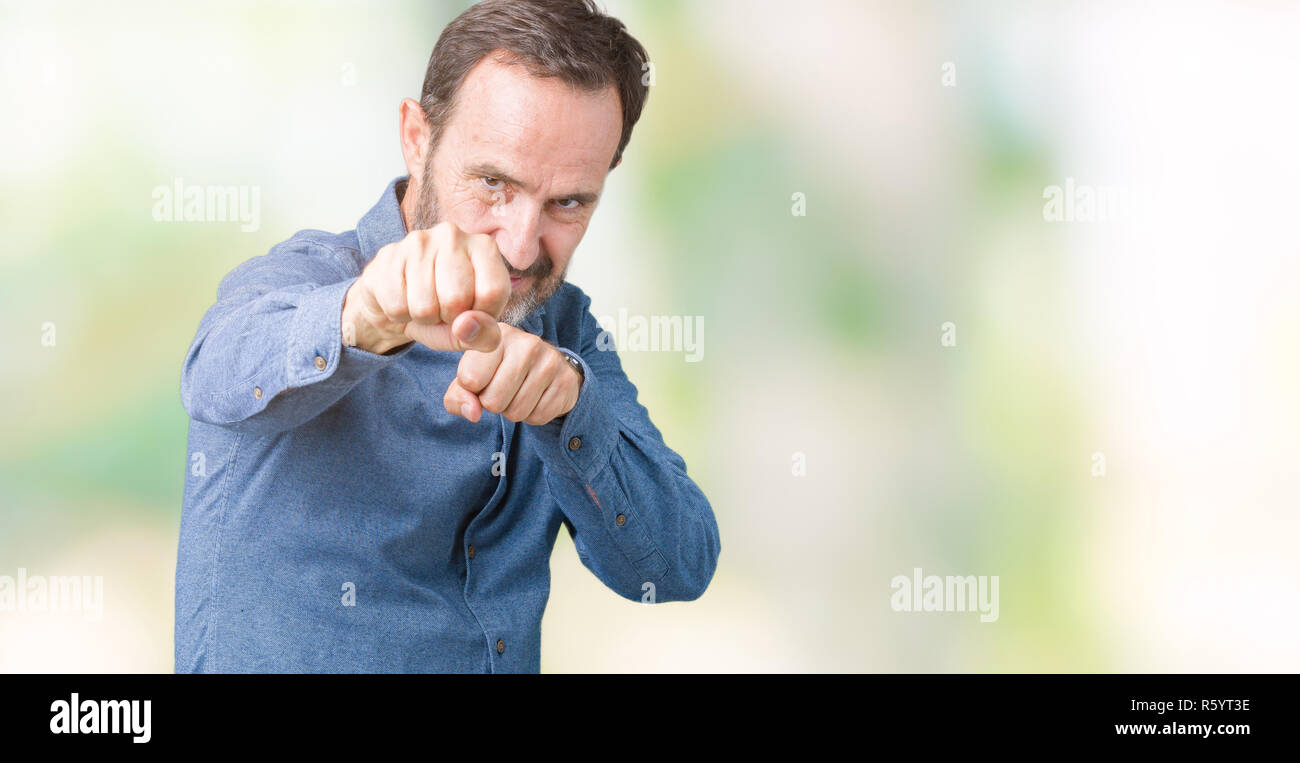 Handsome middle age elegant senior man over isolated background ...