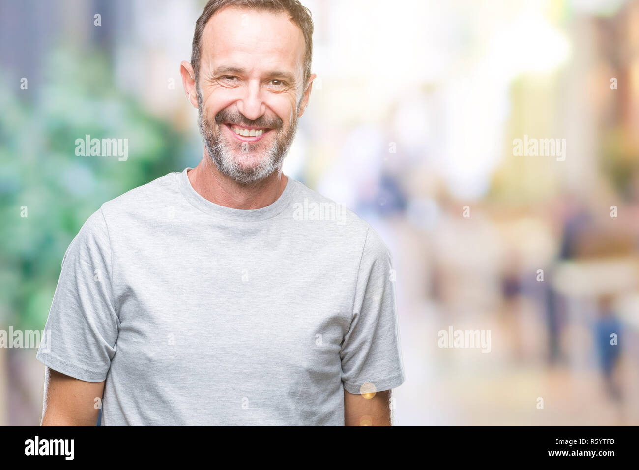 Middle age senior hoary man over isolated background with a happy and ...