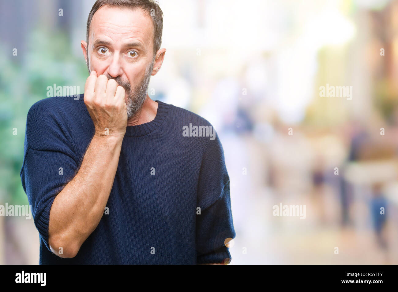 Middle age hoary senior man over isolated background looking stressed ...