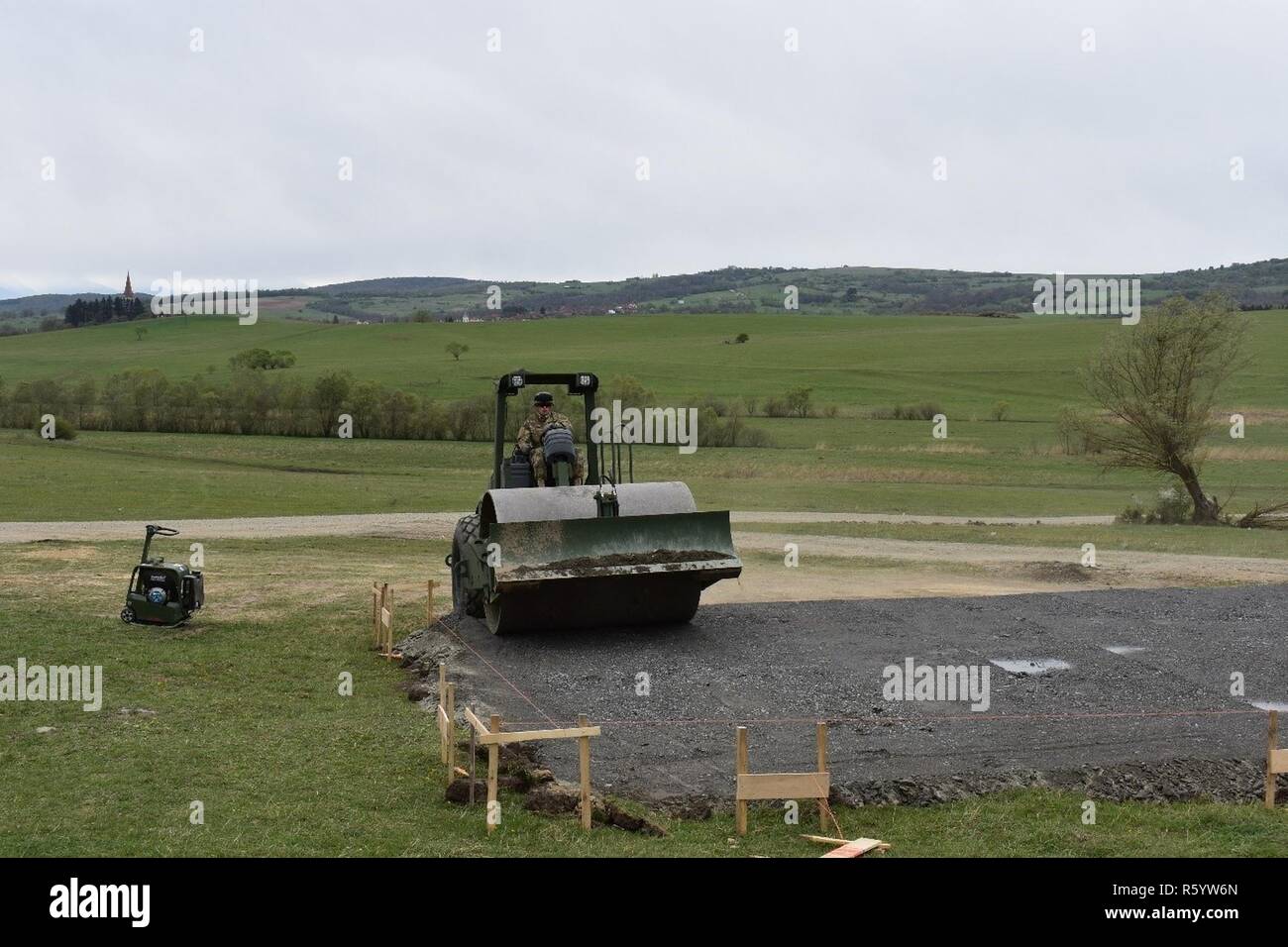 Sgt. Jesse Ellis, a heavy equipment operator of 390th Engineer Company ...