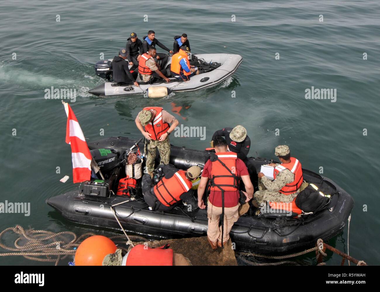 Divers from Underwater Construction Team (UCT) 1 and their counterparts ...
