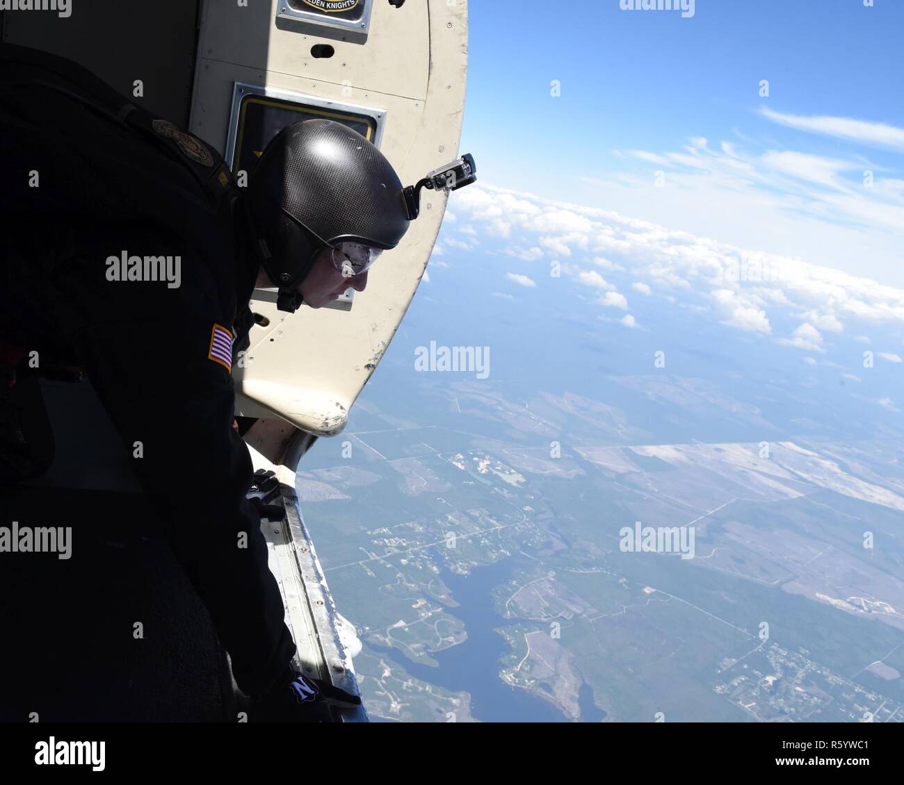 A U.S. Army Golden Knights skydive team member observes the ground ...