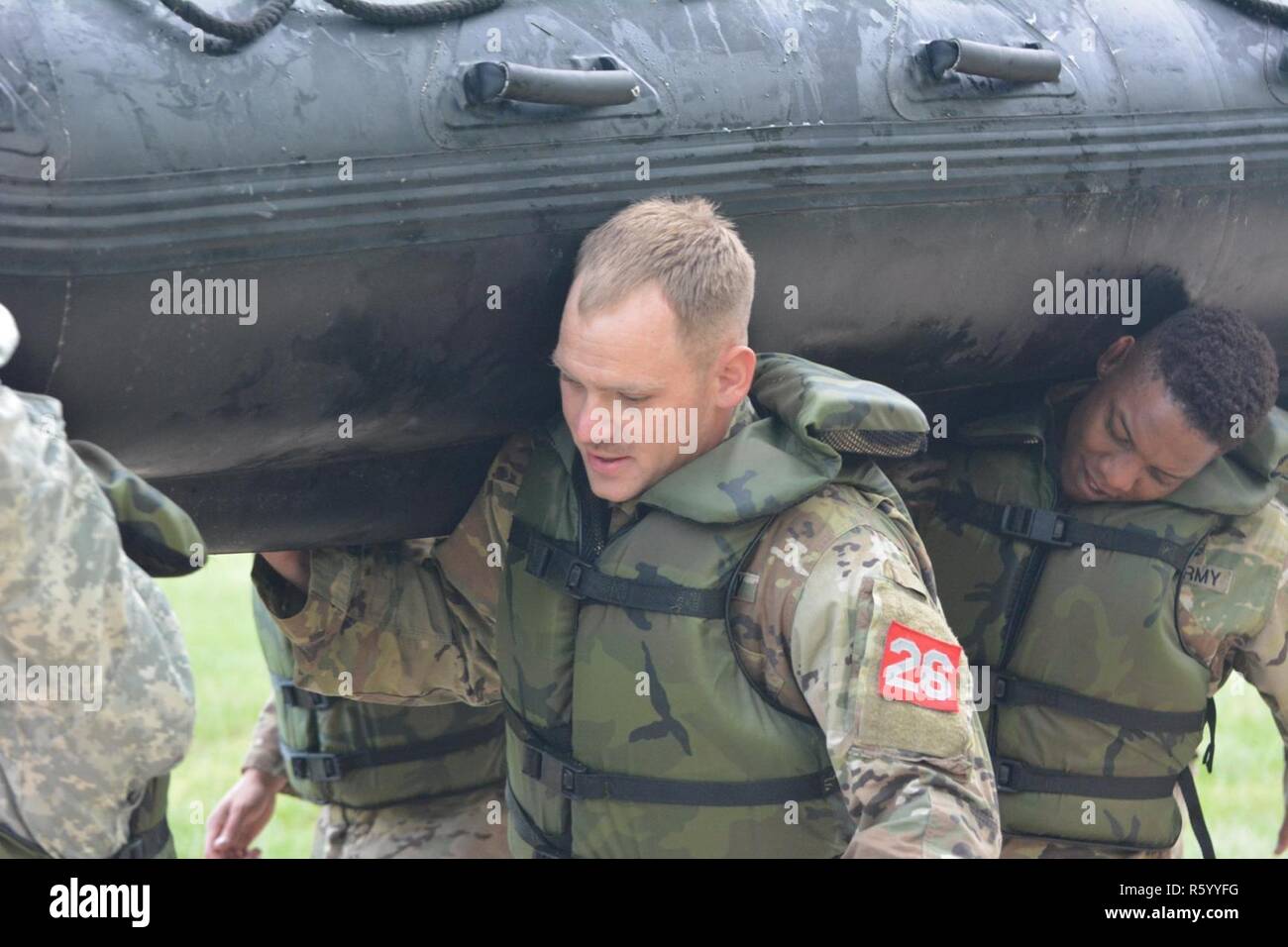Spc. Drake Davis, 84th En. Bn. to carries a 350 pound Zodiac boat to ...