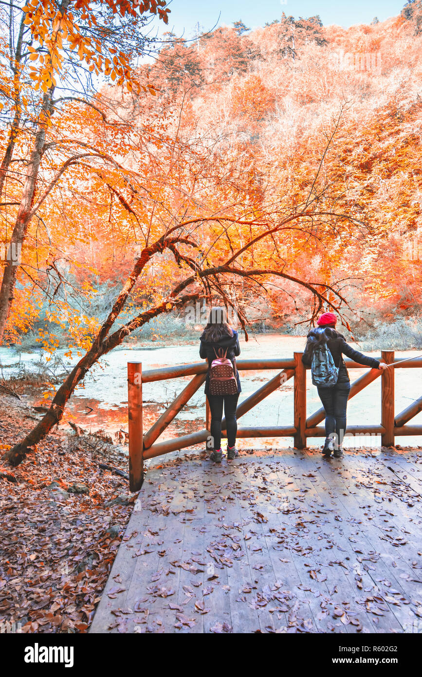 Women take photo of pond at Yedigoller Nature park located in Bolu ...