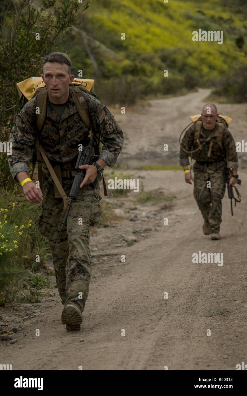 U.S. Marine Corps Capt. Cameron Heard, left, and U.S. Marine Corps ...