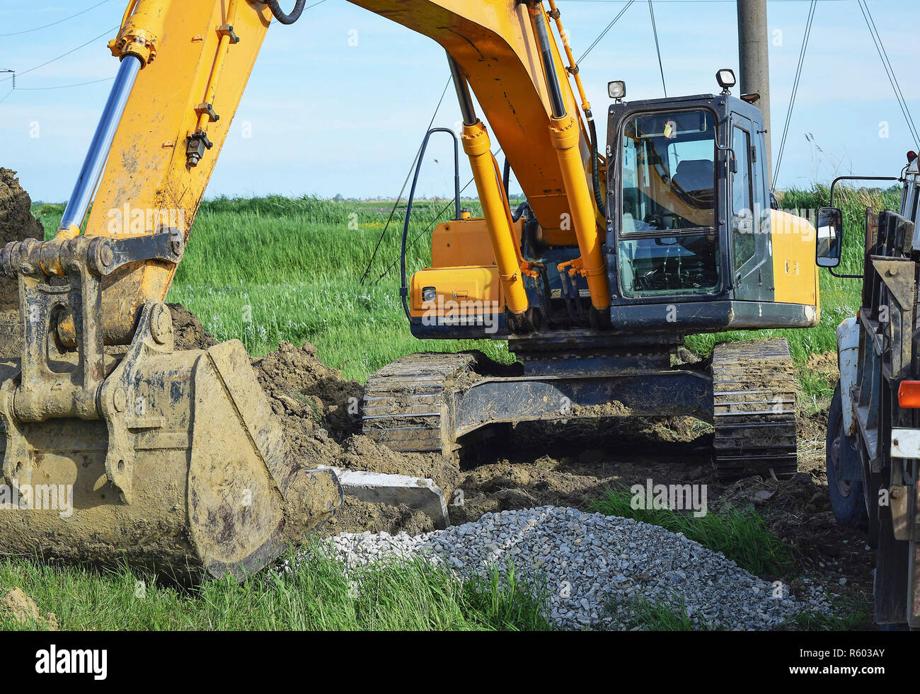 Bucket of the excavator on installation Stock Photo - Alamy