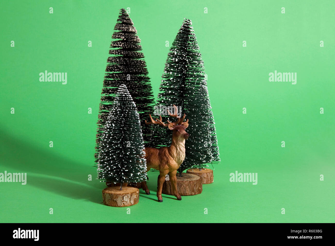 green forest firs and reindeer Stock Photo - Alamy