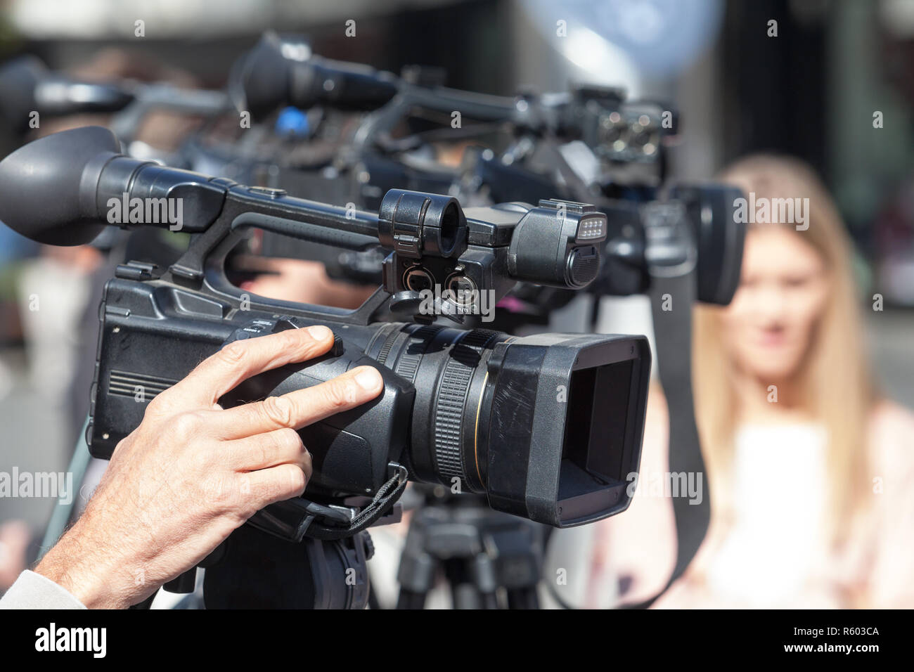 News conference. Filming an event with a video camera Stock Photo - Alamy