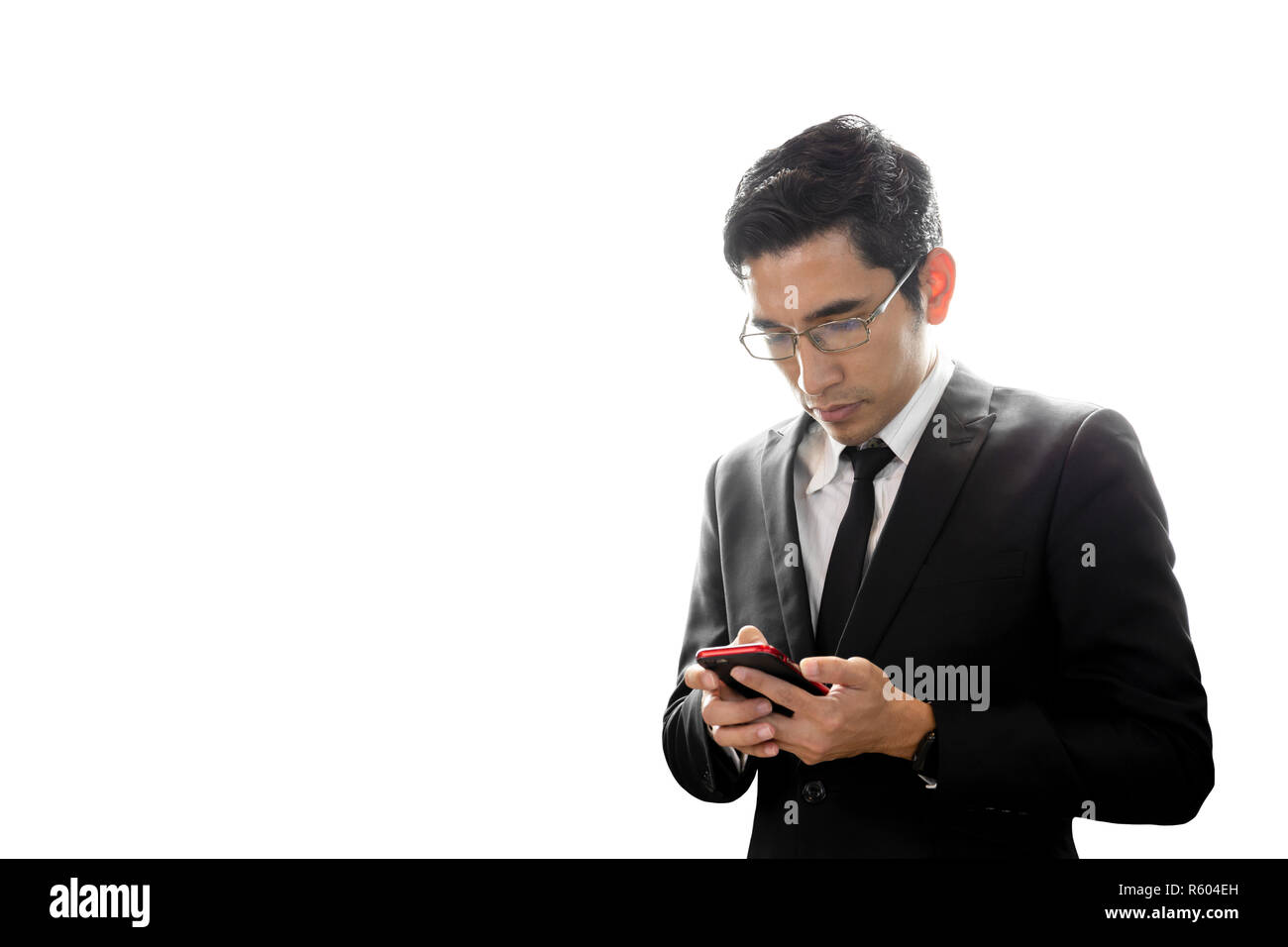 Asian businessman using mobile phone texting isolated in white ...