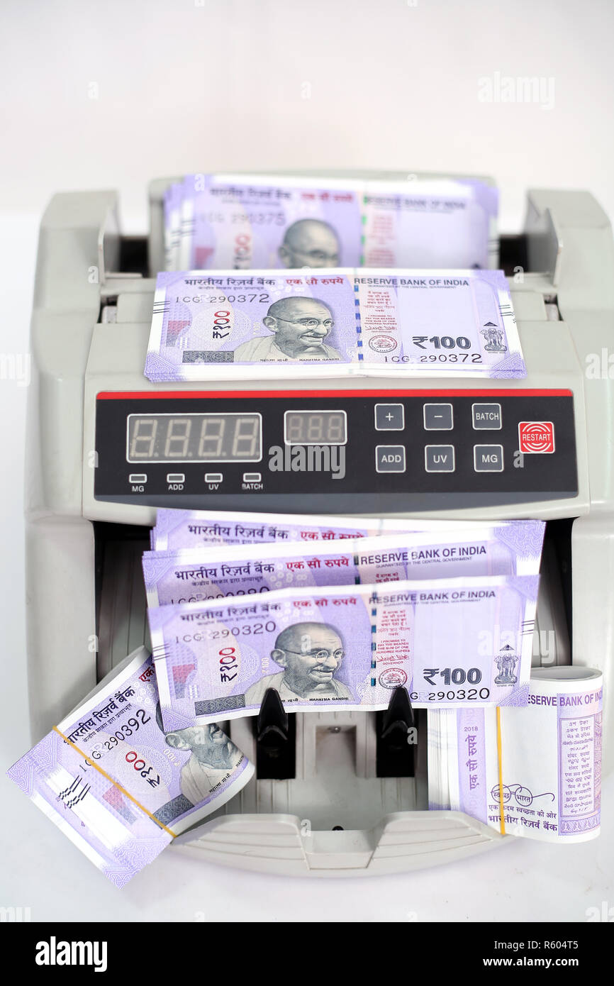Indian banknote on Money counting machine. Isolated on the white ...