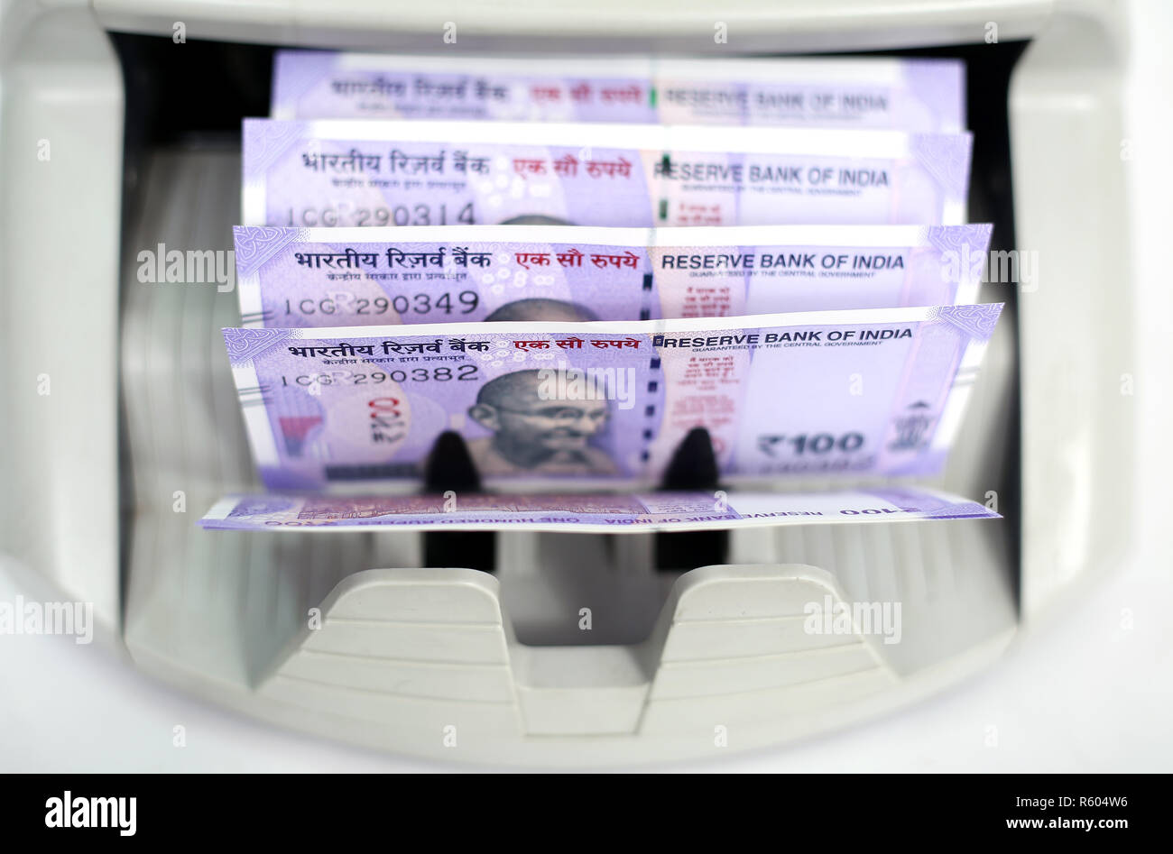 Automatic money counting in the machine. Isolated on the white ...