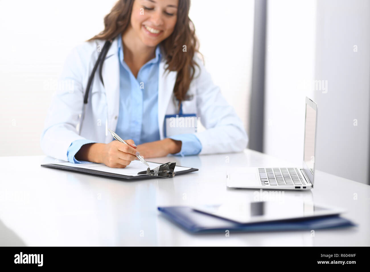 Unknown woman doctor writing hi-res stock photography and images - Alamy