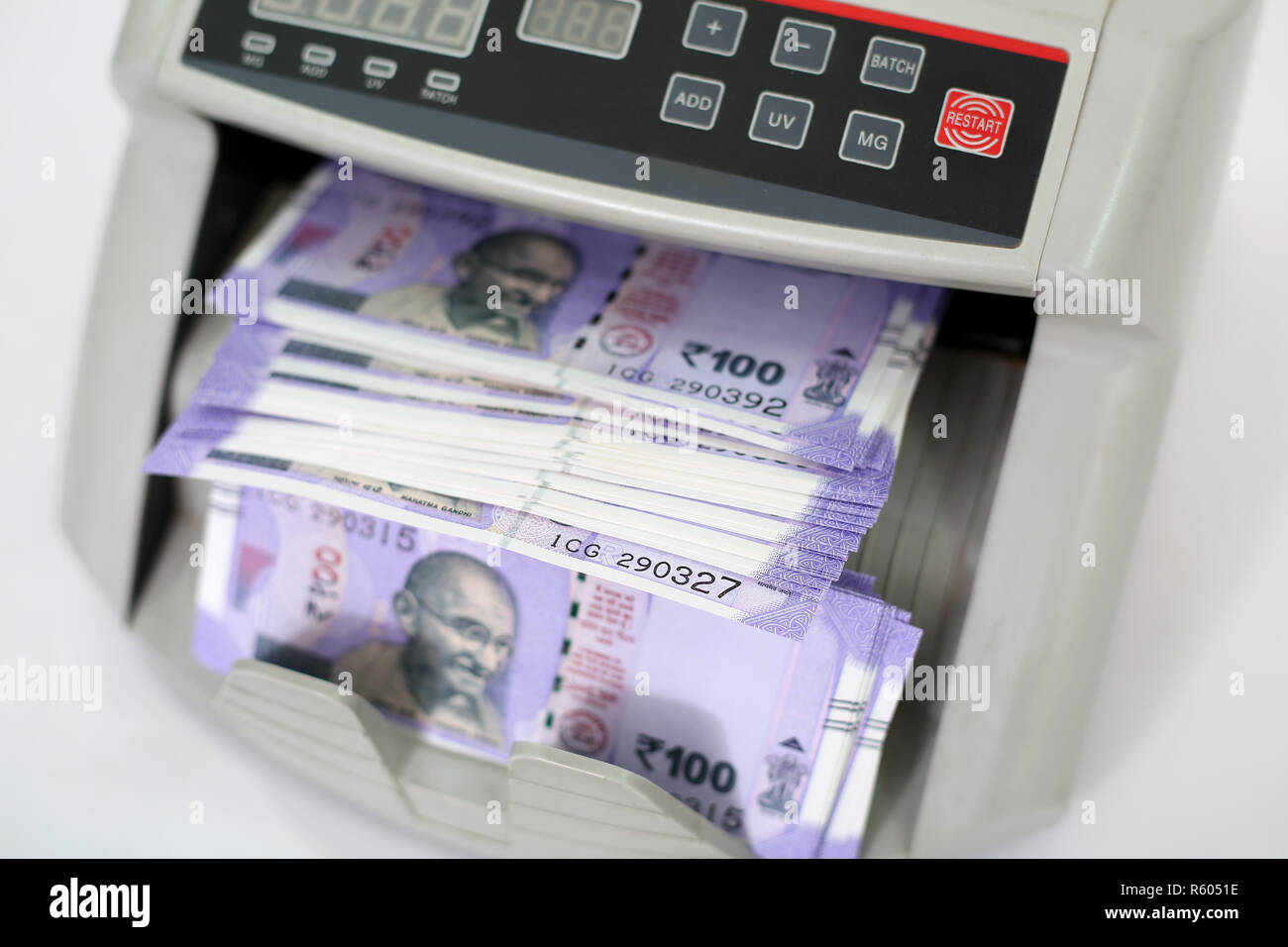 Indian banknotes one hundred rupees at the currency counter machine ...