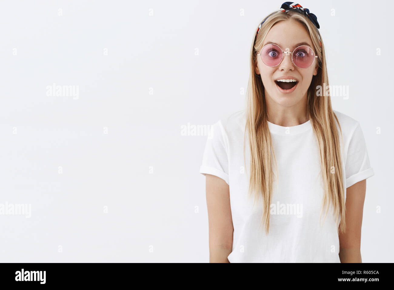 Stylish and fashionable attrative young european female being amazed ...