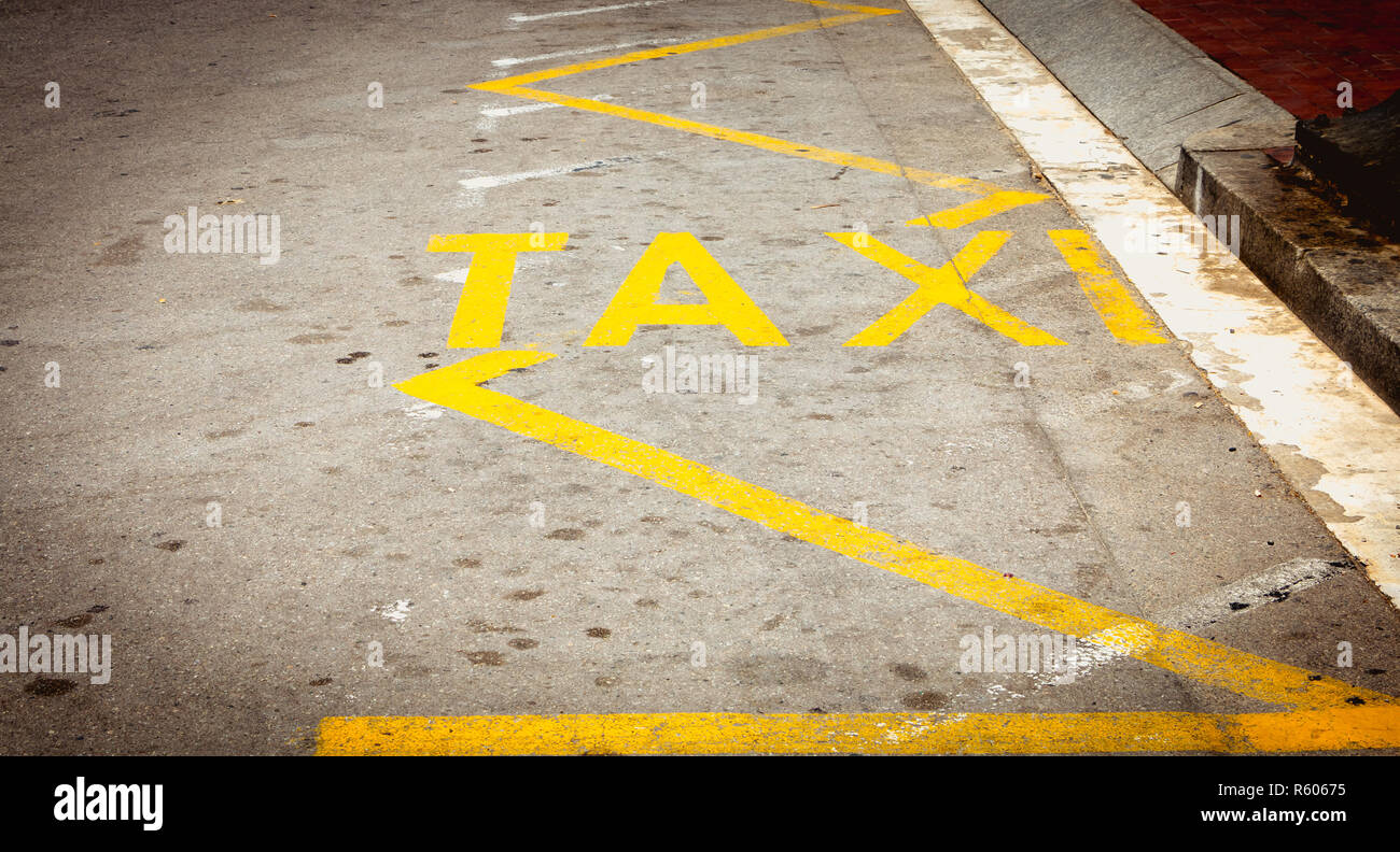 yellow paint on the road that indicates a taxi line Stock Photo - Alamy