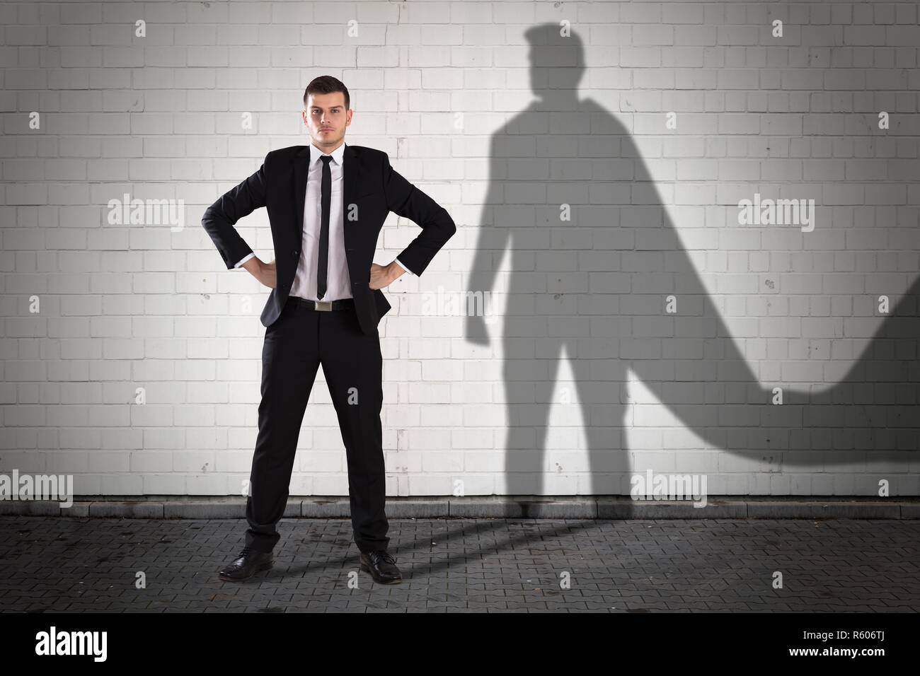 Shadow Formed Behind The Businessman Stock Photo - Alamy