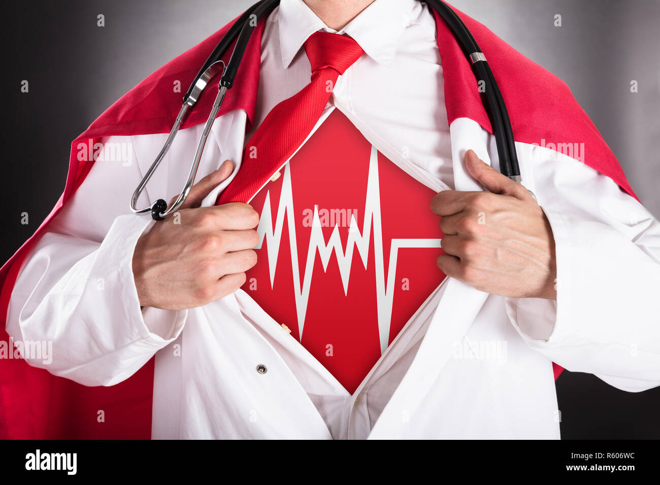 Superhero Doctor Showing Heartbeat Sign Stock Photo - Alamy