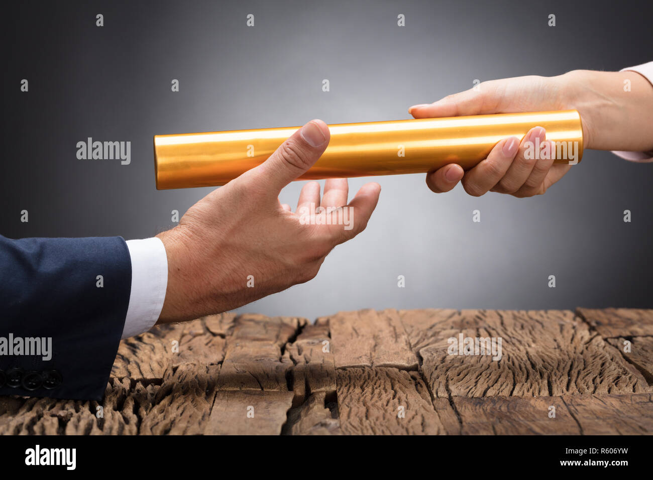 Human hand holding baton hi-res stock photography and images - Alamy
