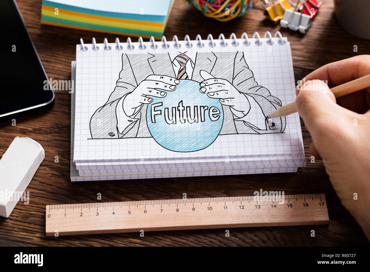 Person Hand Holding Pencil On Notepad Stock Photo - Alamy