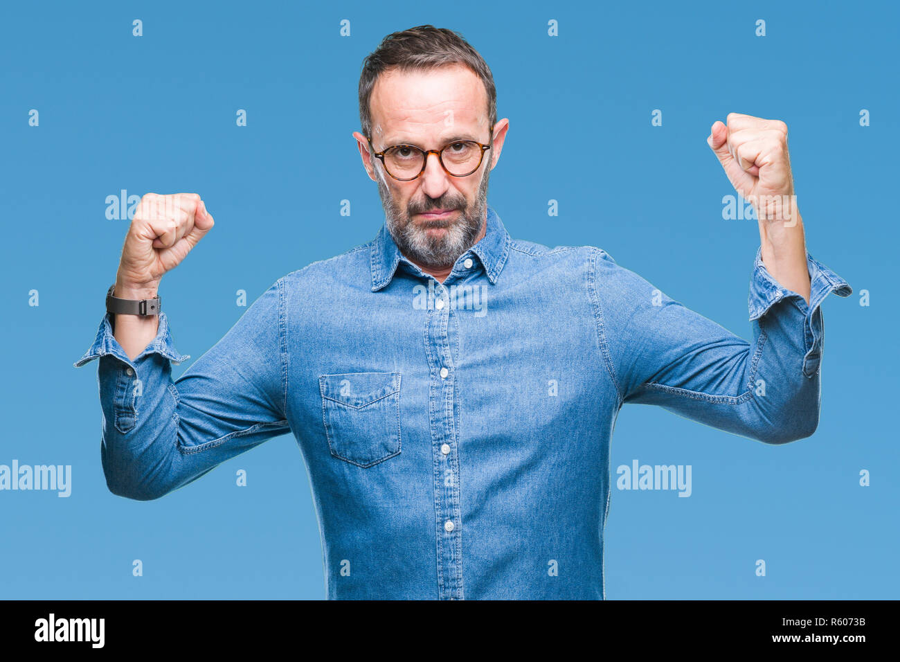 Middle age hoary senior man wearing glasses over isolated background ...