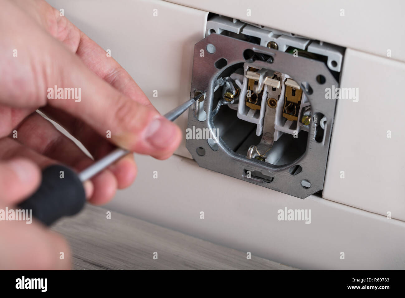 Person's Hand Repairing Electrical Socket Stock Photo - Alamy